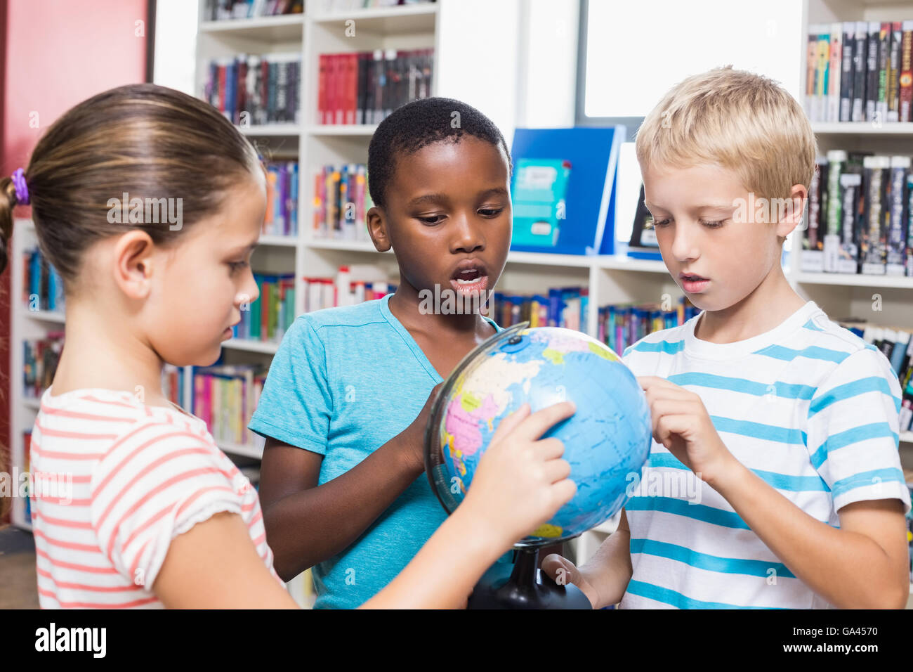 Kids studying in library hi-res stock photography and images - Alamy