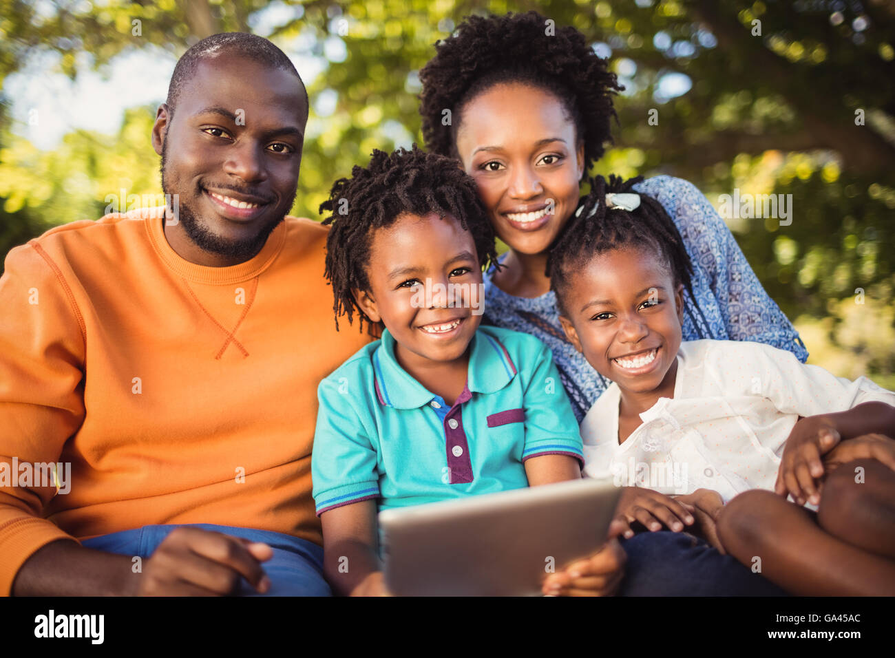 Happy family posing together Stock Photo - Alamy