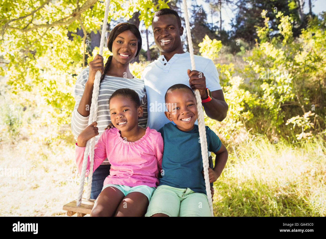 Happy family posing together Stock Photo - Alamy