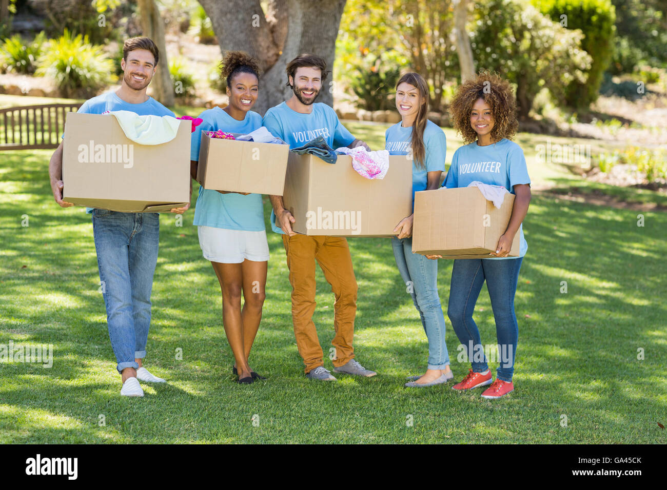 Group of volunteer holding cartons Stock Photo - Alamy