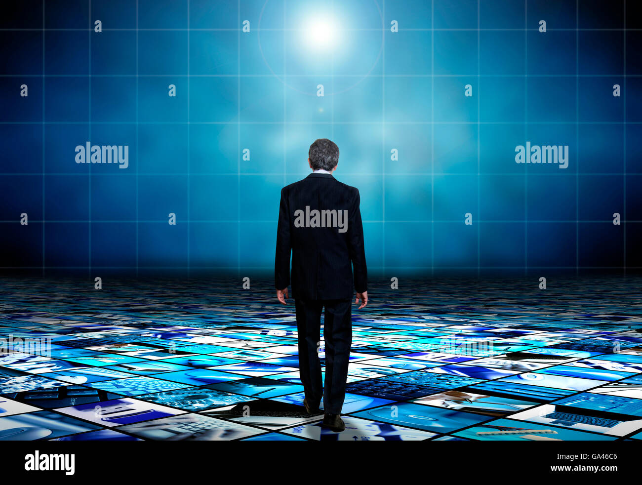 man in suit walking in a technology space Stock Photo - Alamy