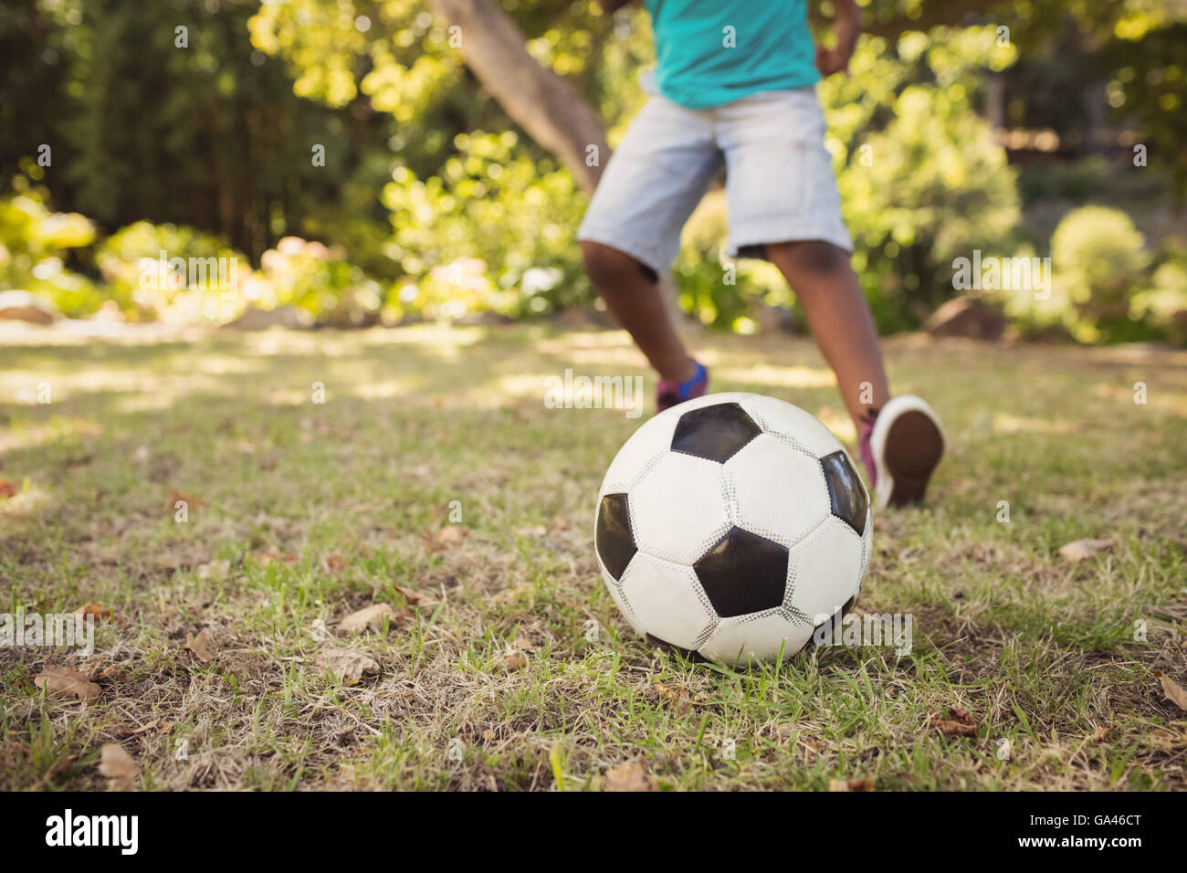 happy child playing football Stock Photo - Alamy