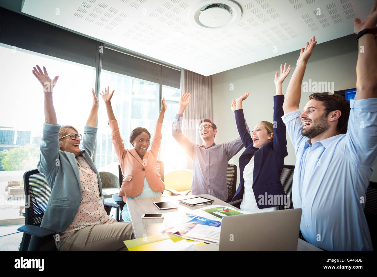 Business people raising their arms Stock Photo - Alamy