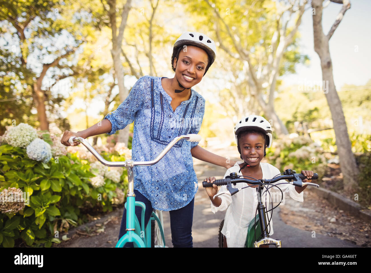 Happy family doing bicycle Stock Photo - Alamy