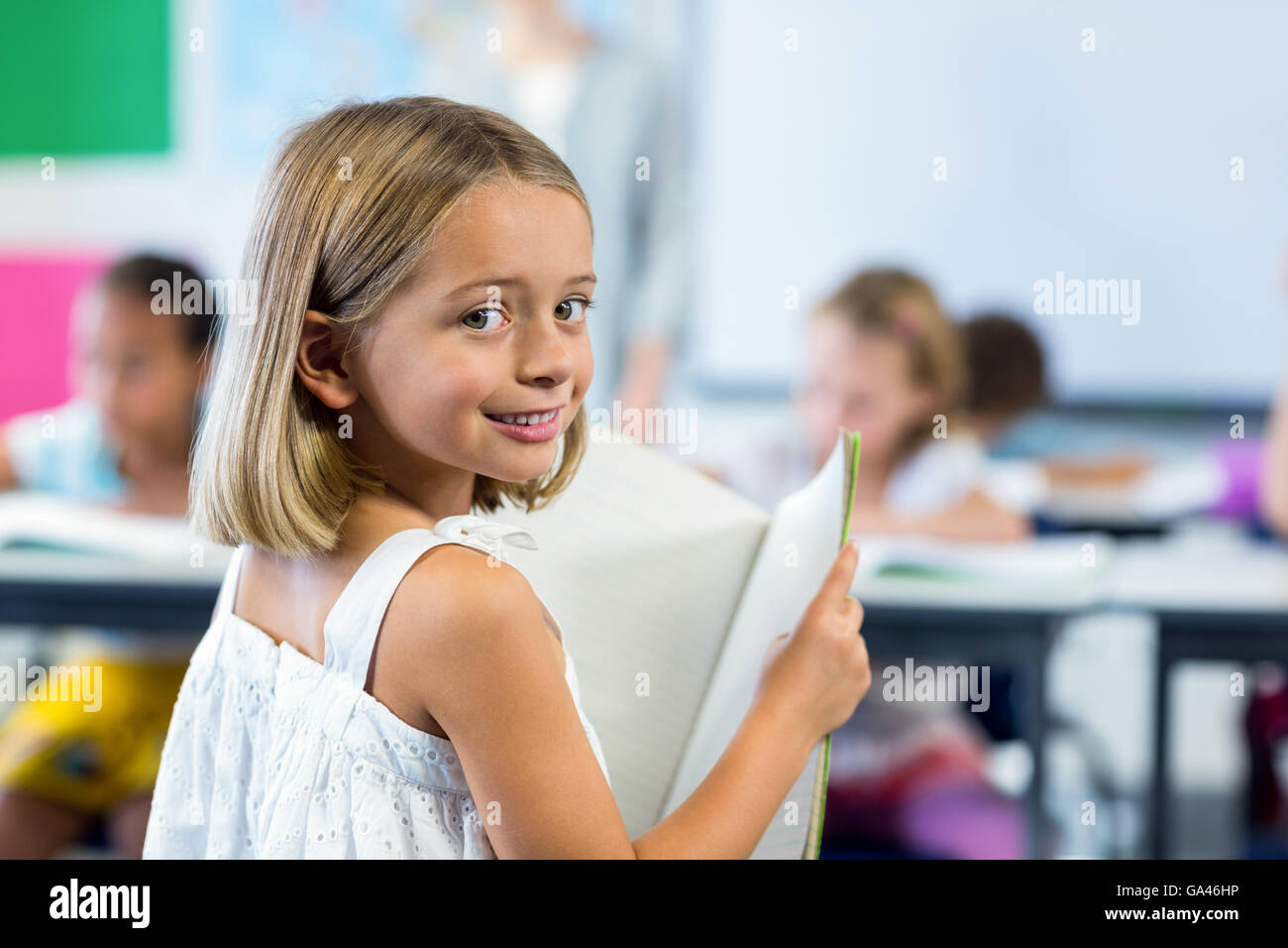 Portrait of girl reading book Stock Photo - Alamy