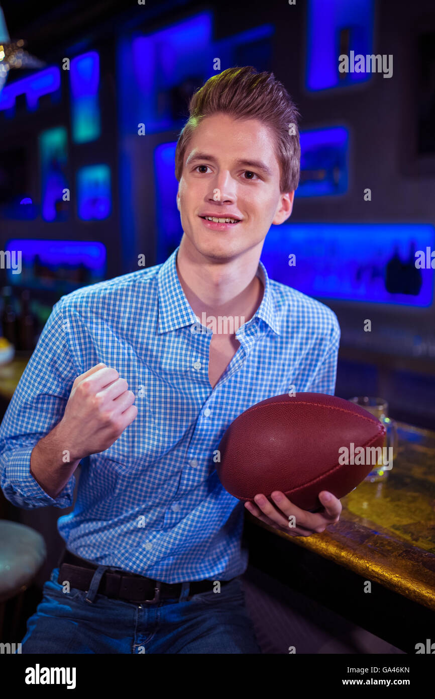 Young man with rugby ball Stock Photo - Alamy