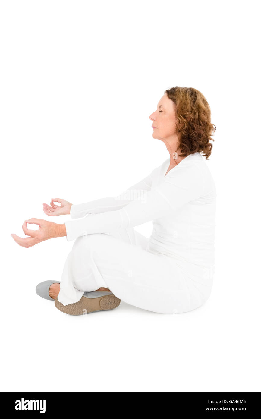 Side view of woman meditating Stock Photo - Alamy