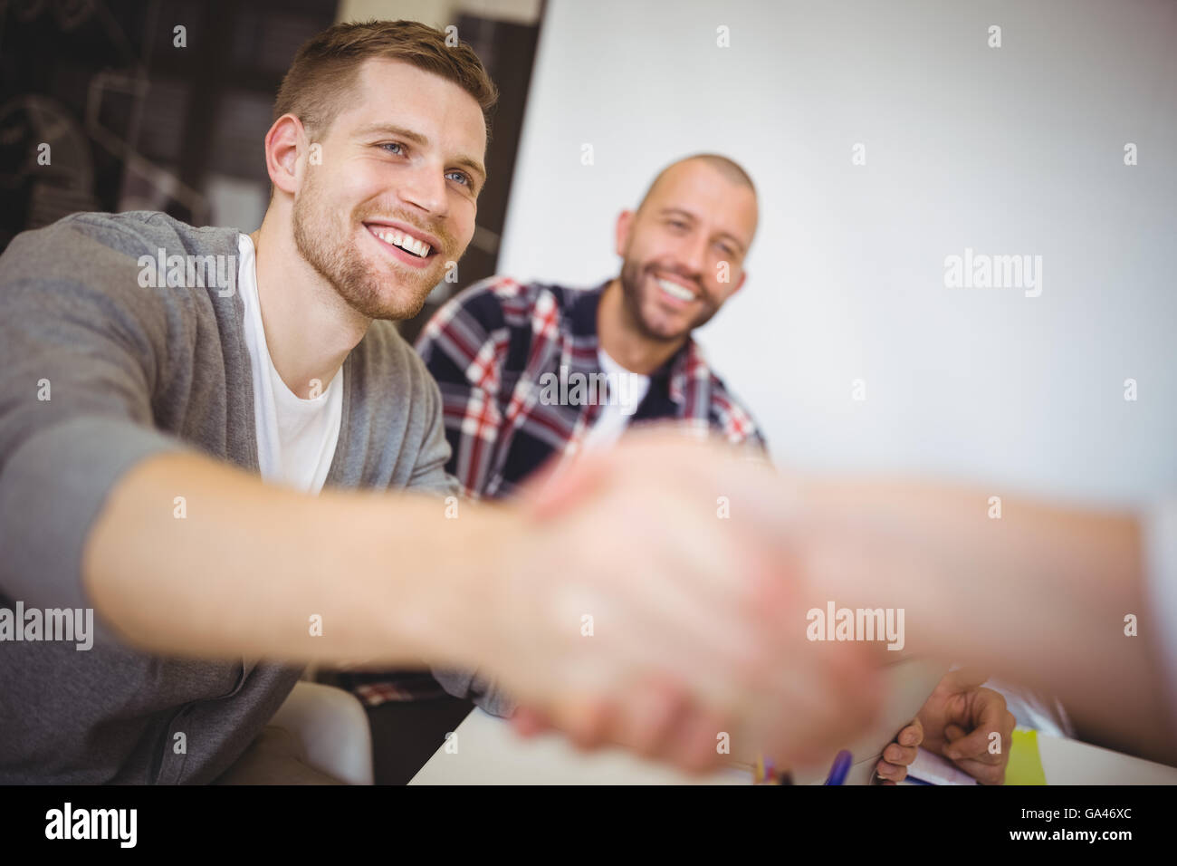 Business business people shaking hands in office Stock Photo - Alamy