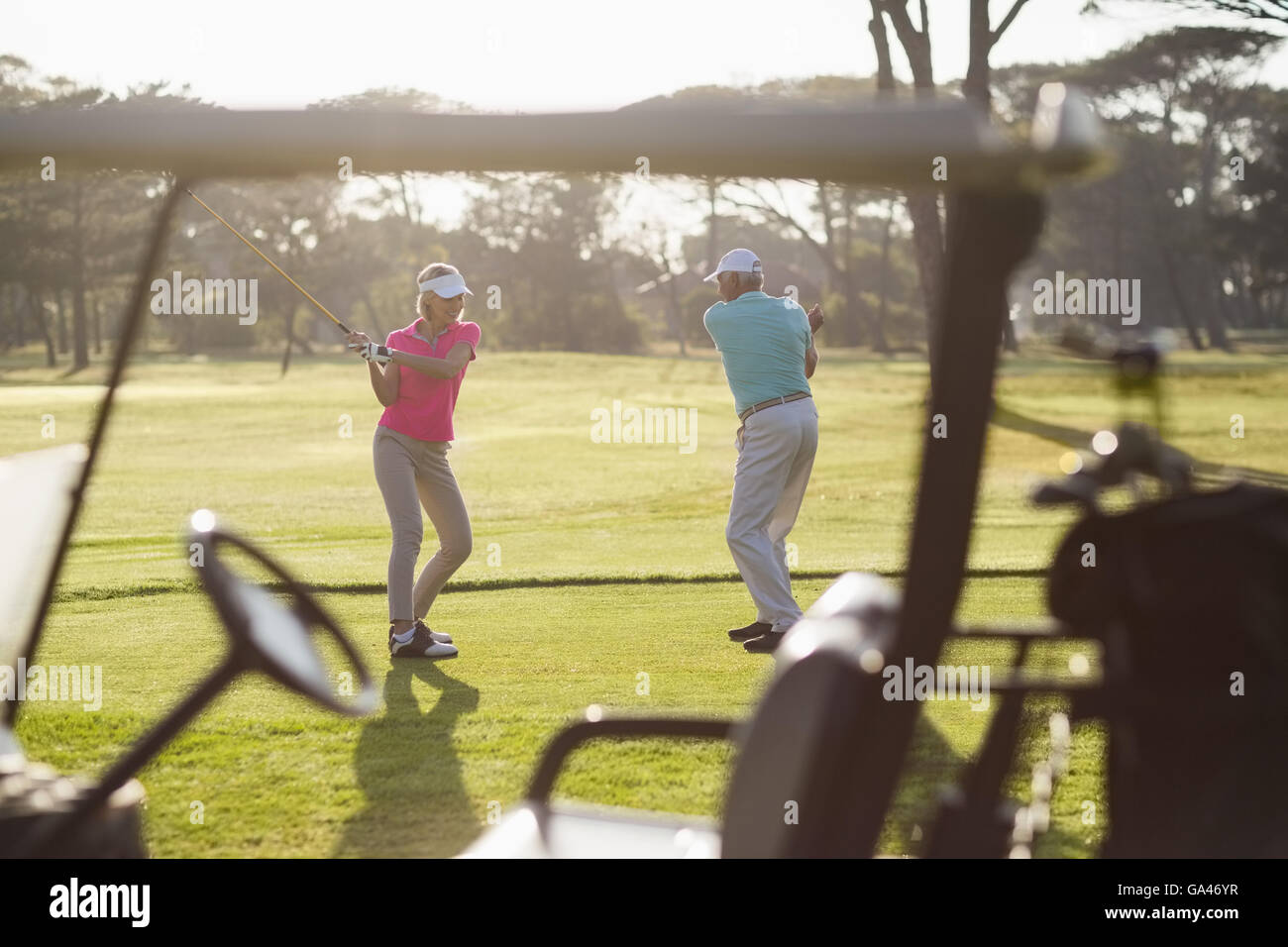 Elderly couple playing golf hi-res stock photography and images - Alamy