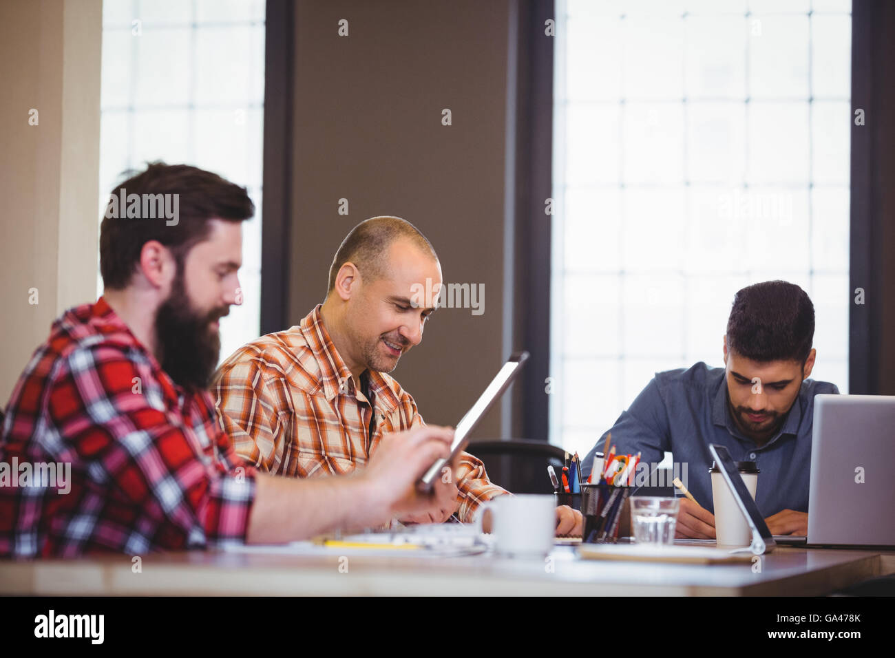 Business people working at desk Stock Photo - Alamy