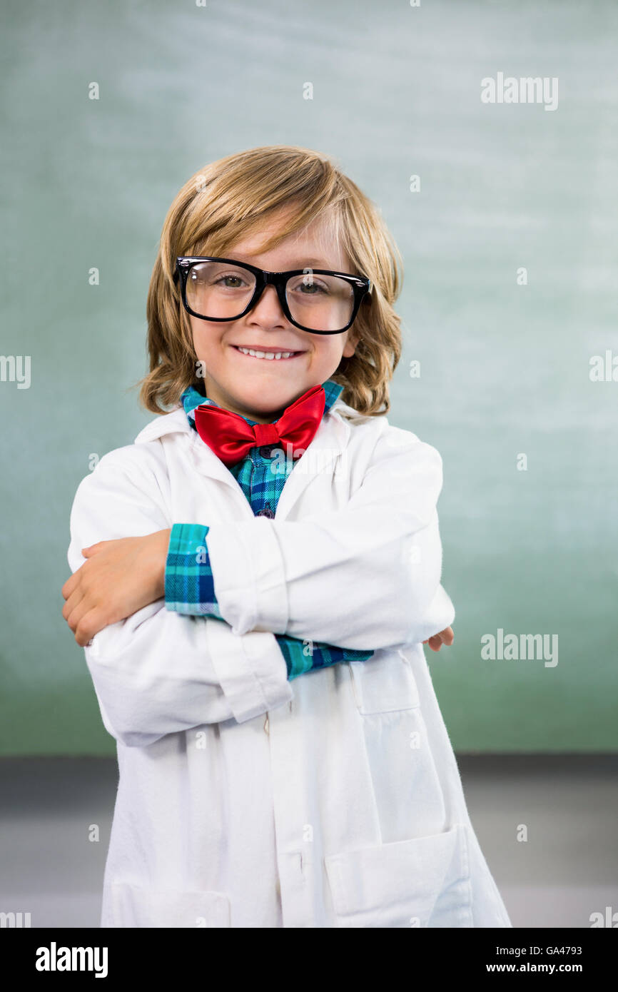 Smiling boy dressed as scientist standing in classroom Stock Photo - Alamy