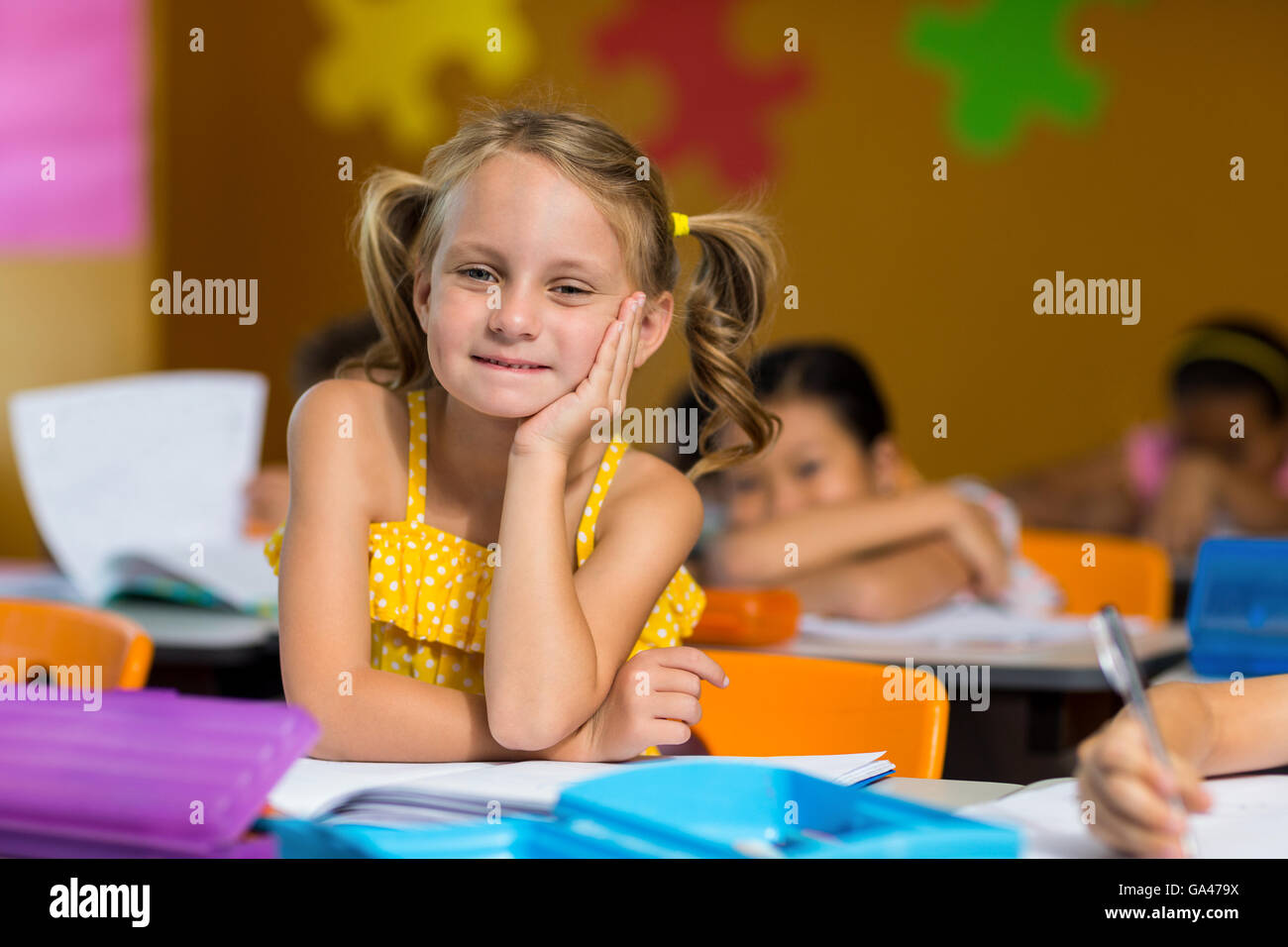 Cute girl in classroom Stock Photo - Alamy