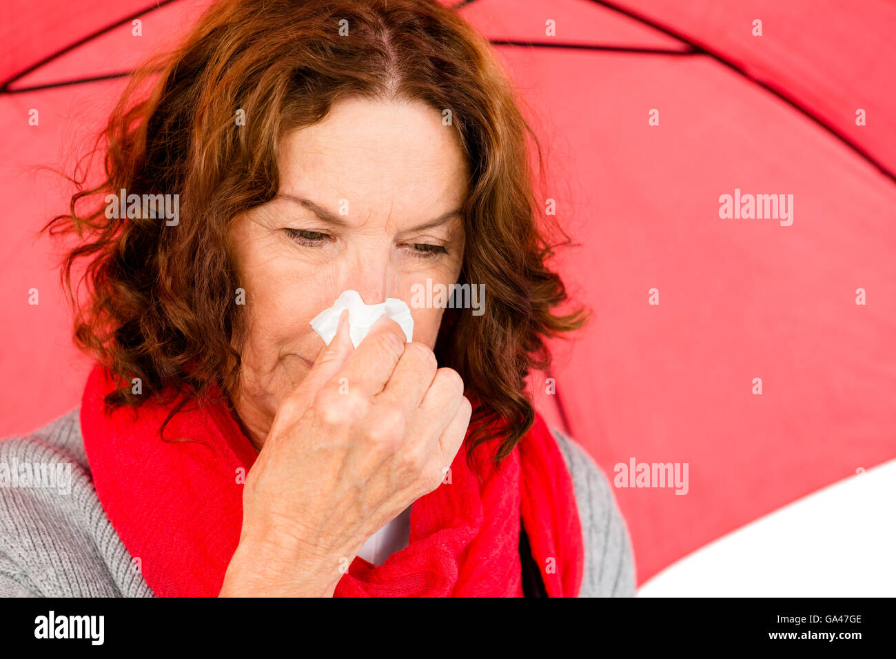 Close-up of mature woman suffering from cold Stock Photo - Alamy