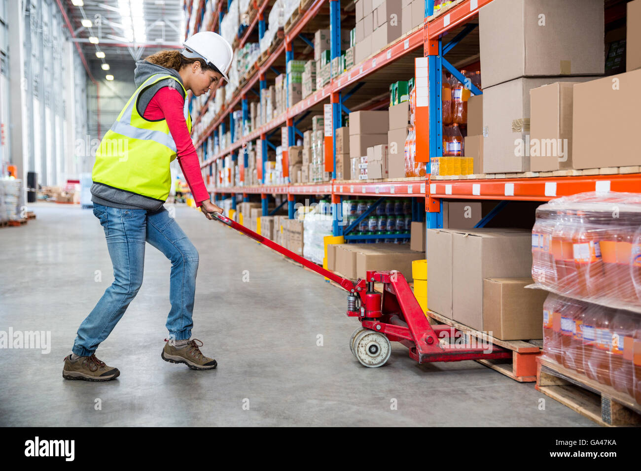 Female warehouse working pushing boxes hi-res stock photography and ...