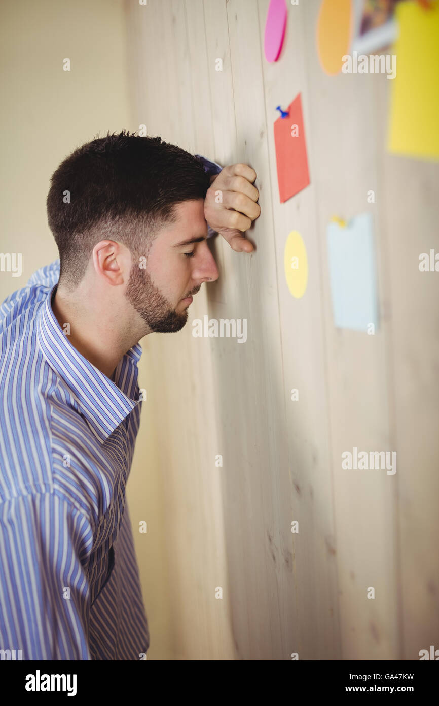 Stressed man in office Stock Photo - Alamy