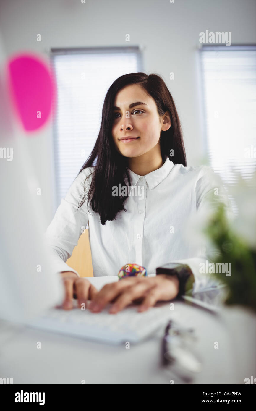 Woman working in office Stock Photo - Alamy