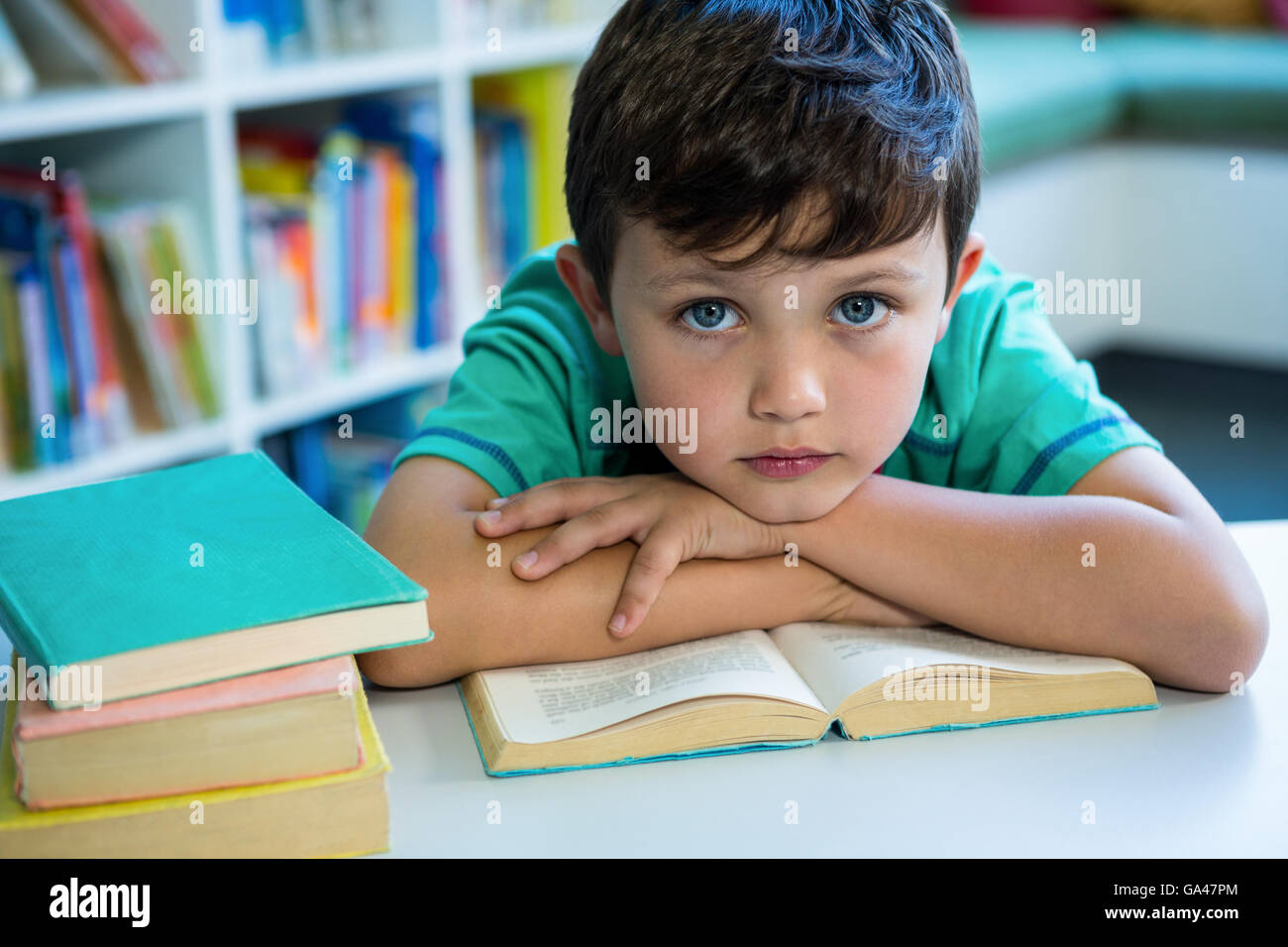 Boy book stack library hi-res stock photography and images - Alamy
