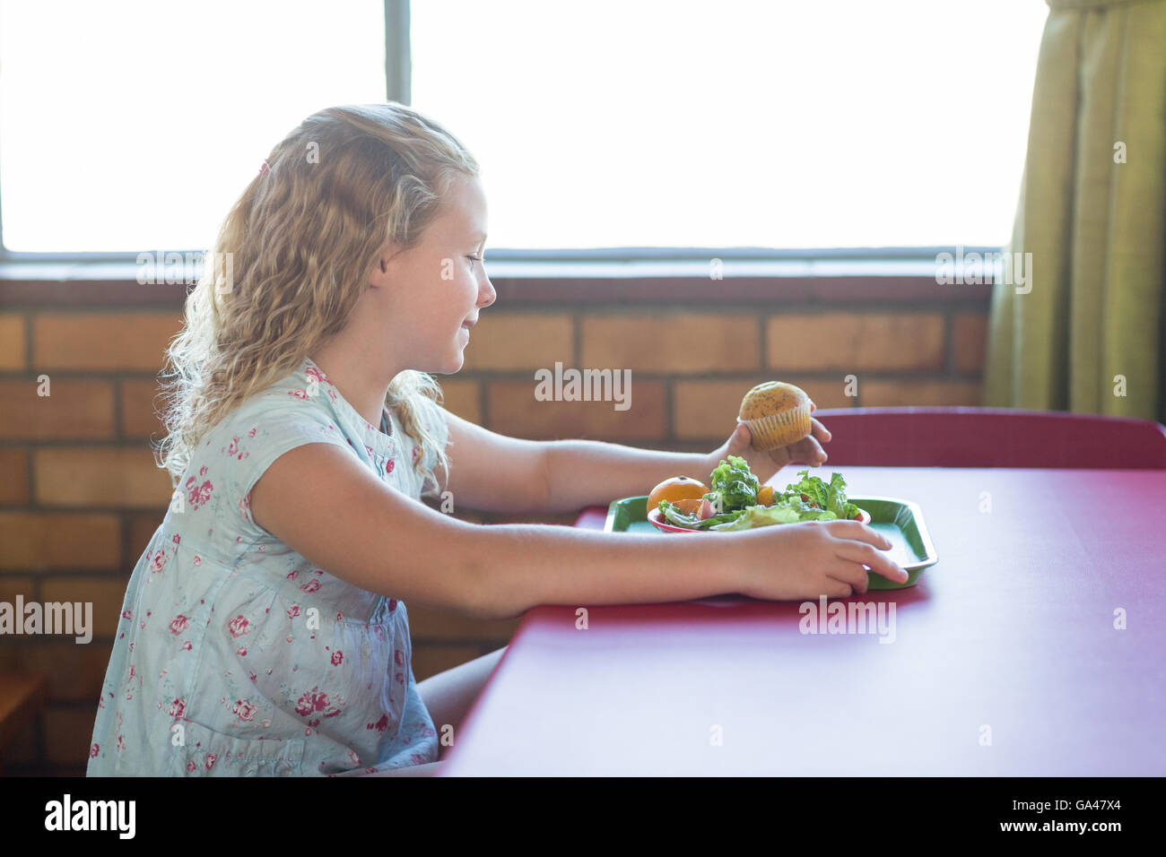 Girl having meal Stock Photo - Alamy