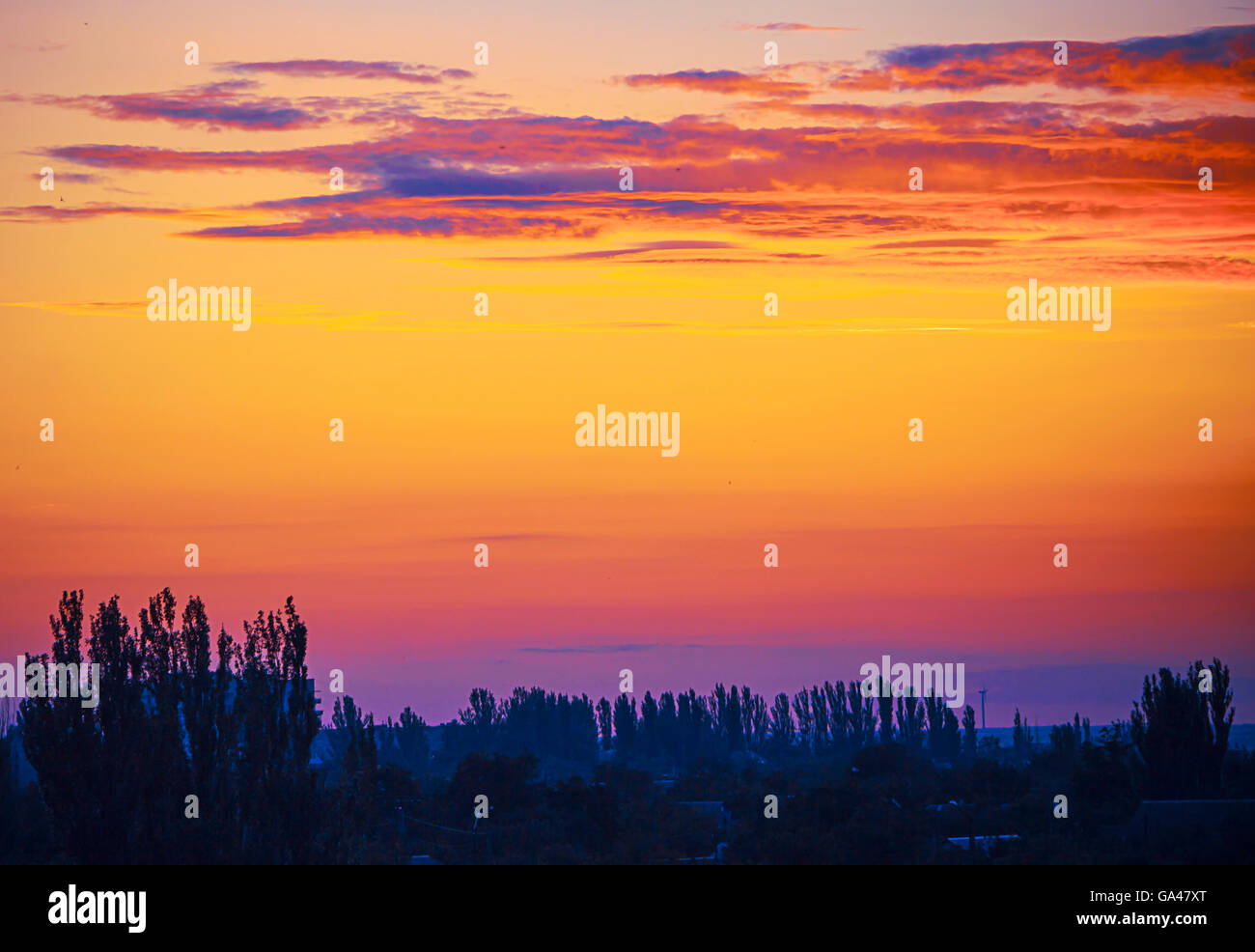 Evening landscape in the red-yellow-blue colors. Evening landscape in ...