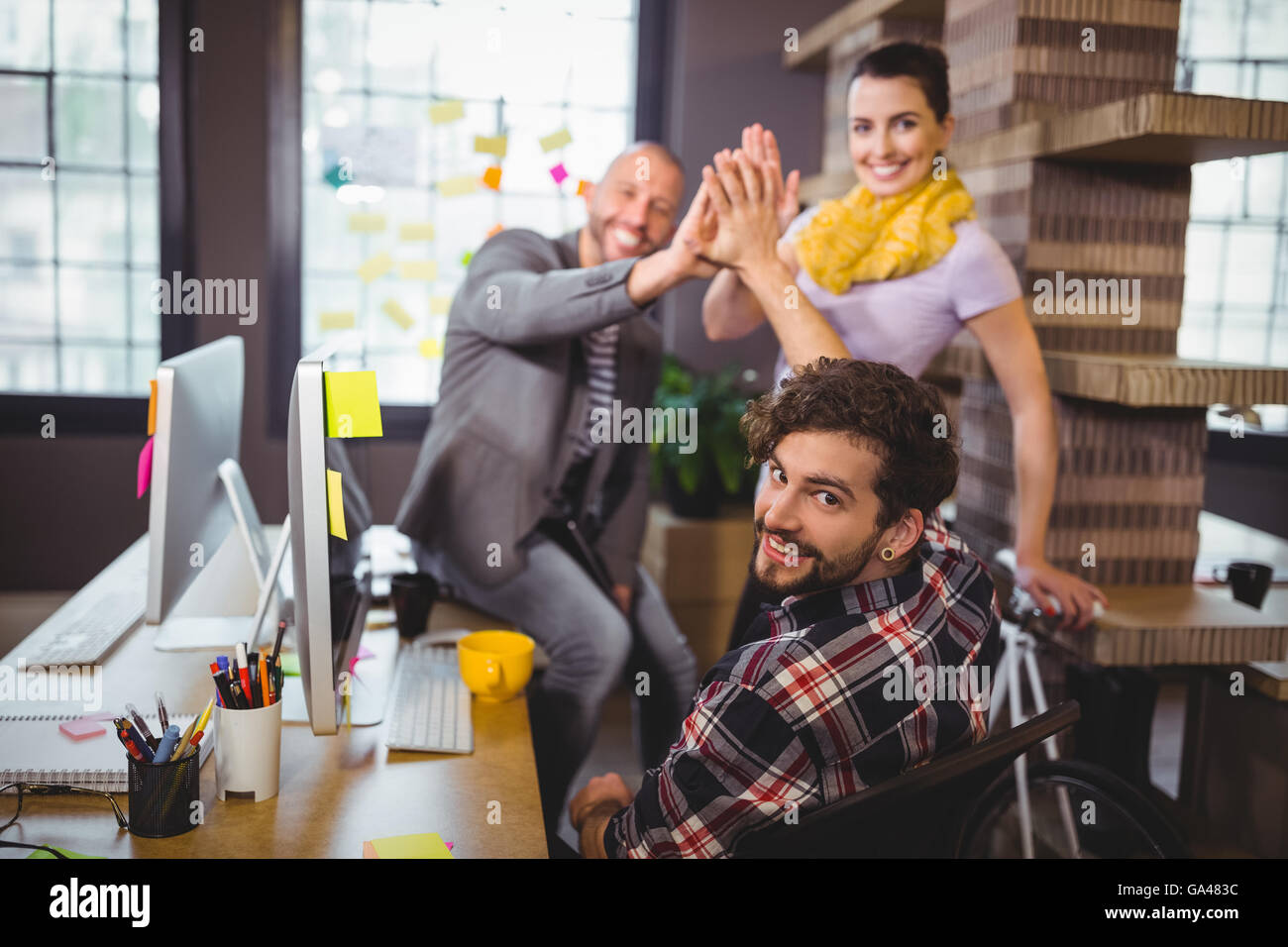 High fiving people hi-res stock photography and images - Alamy