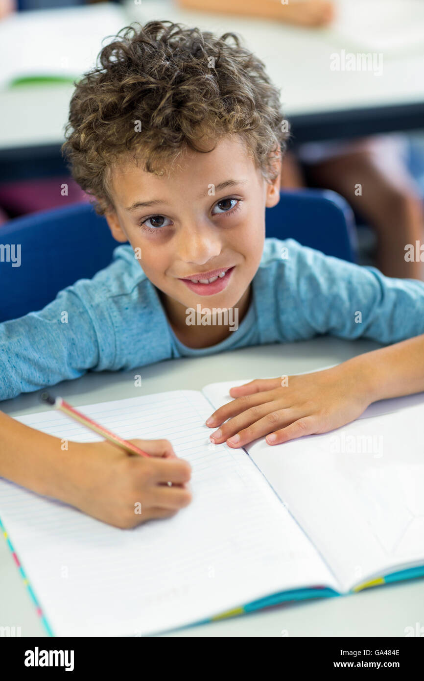 Boy writing book hi-res stock photography and images - Alamy