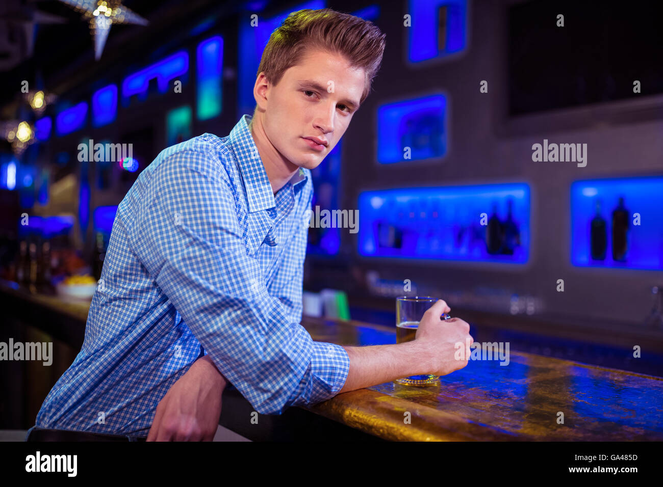 Portrait of man at bar counter Stock Photo - Alamy