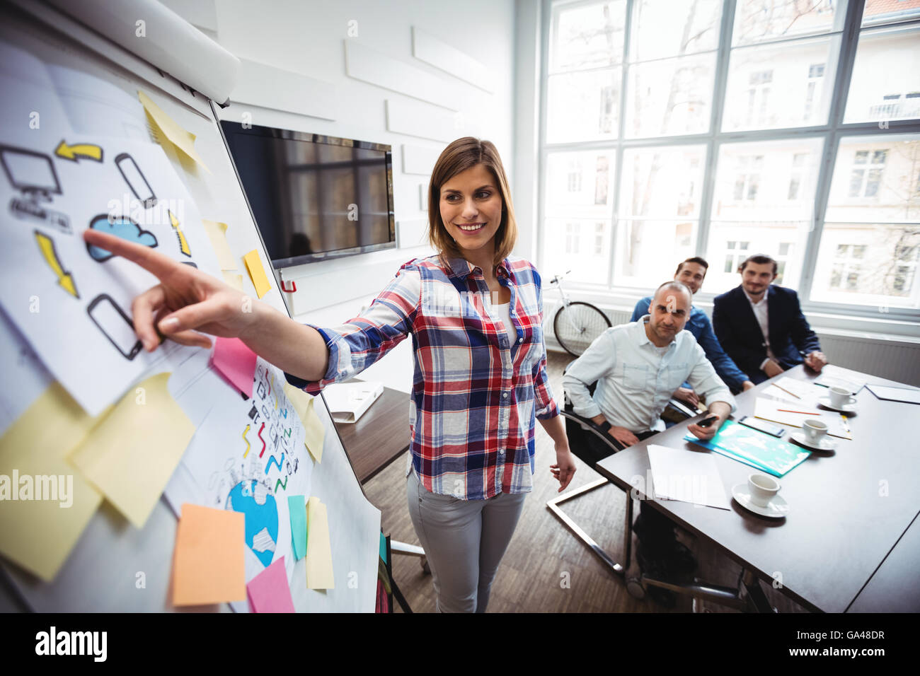 Happy businesswoman giving presentation Stock Photo - Alamy