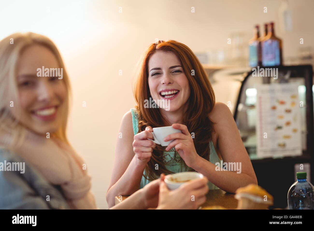 Portrait of cheerful friends at coffee shop Stock Photo - Alamy