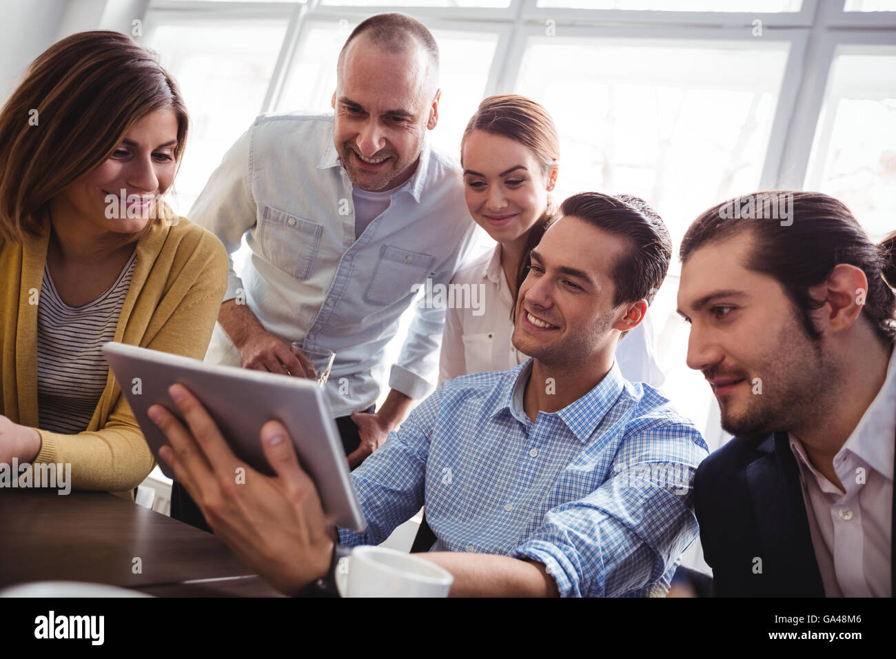 Business people using digital tablet Stock Photo - Alamy