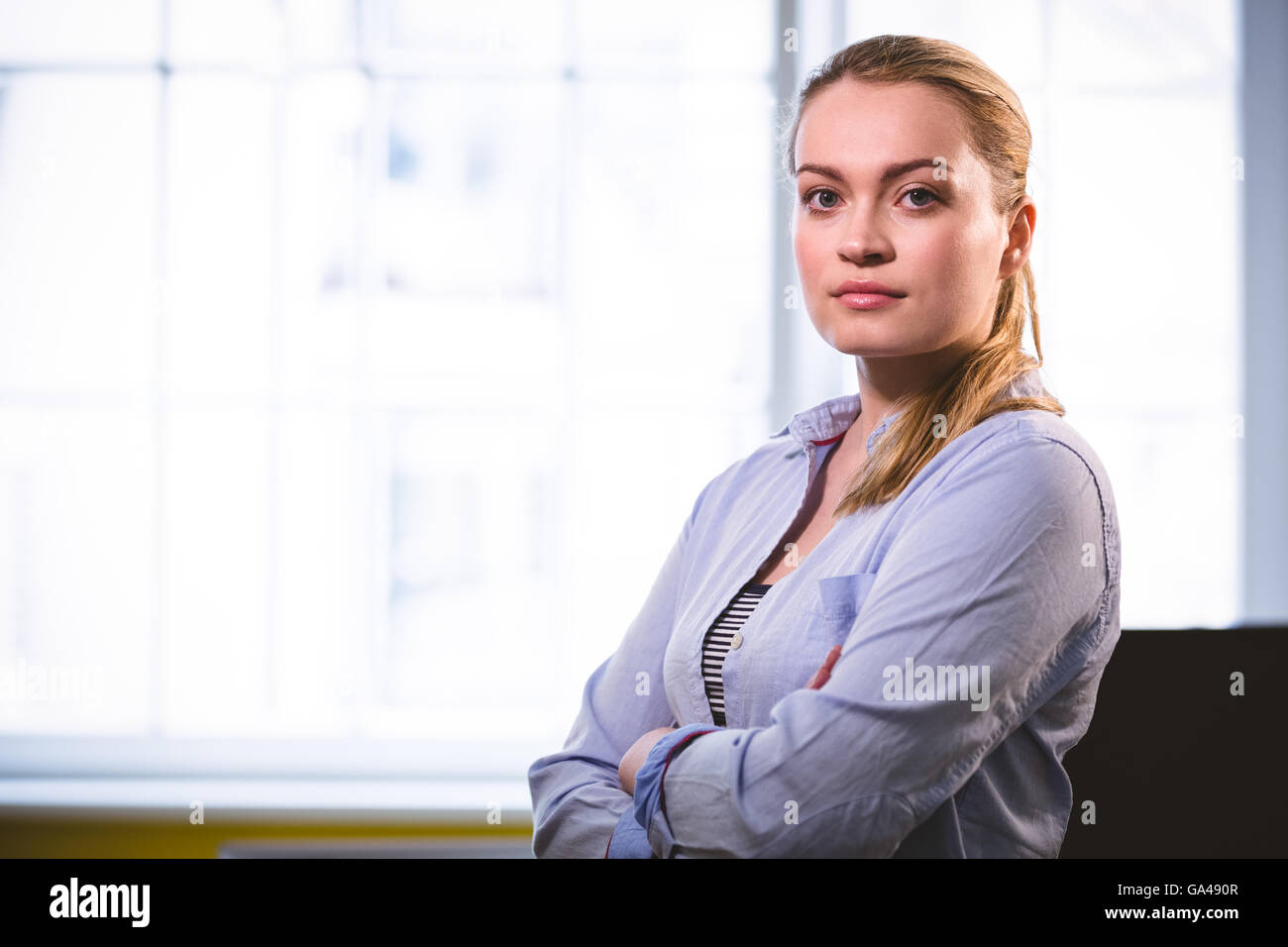 Portrait confident corporate executive at creative office Stock Photo ...