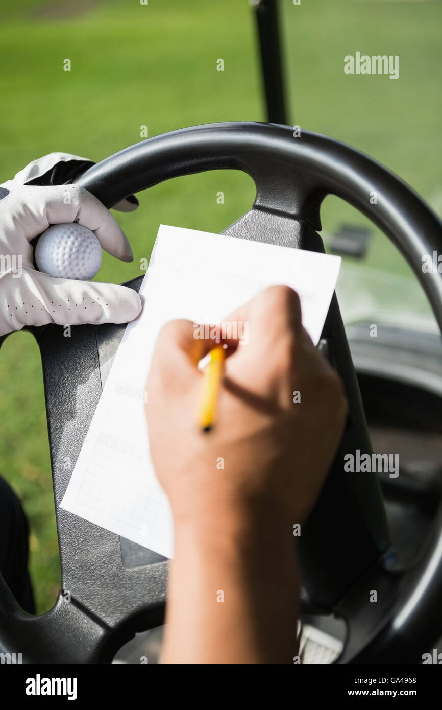Close up of hand filling a piece of paper Stock Photo - Alamy