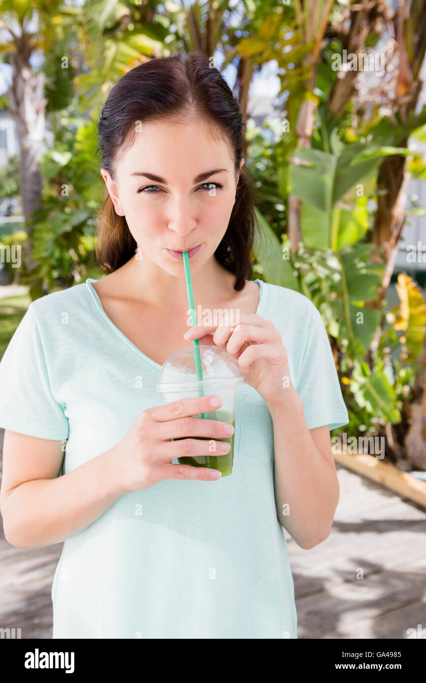 Portrait of woman having juice Stock Photo - Alamy