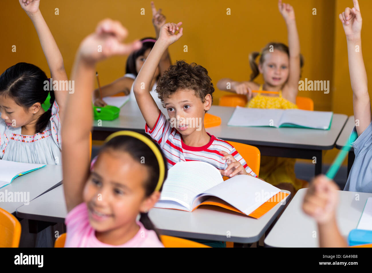 Boy raising arm hi-res stock photography and images - Alamy