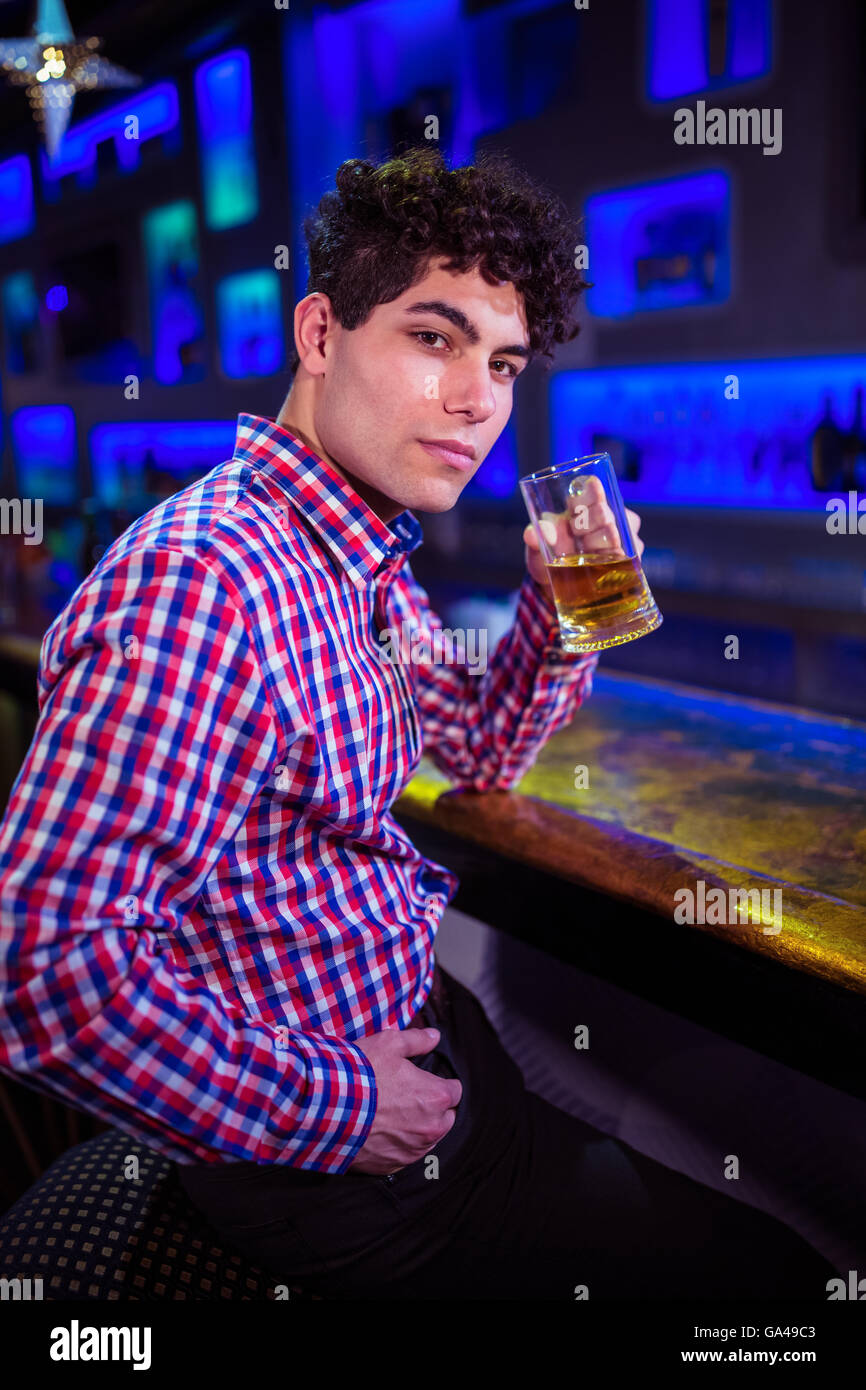 Portrait of man drinking beer Stock Photo - Alamy