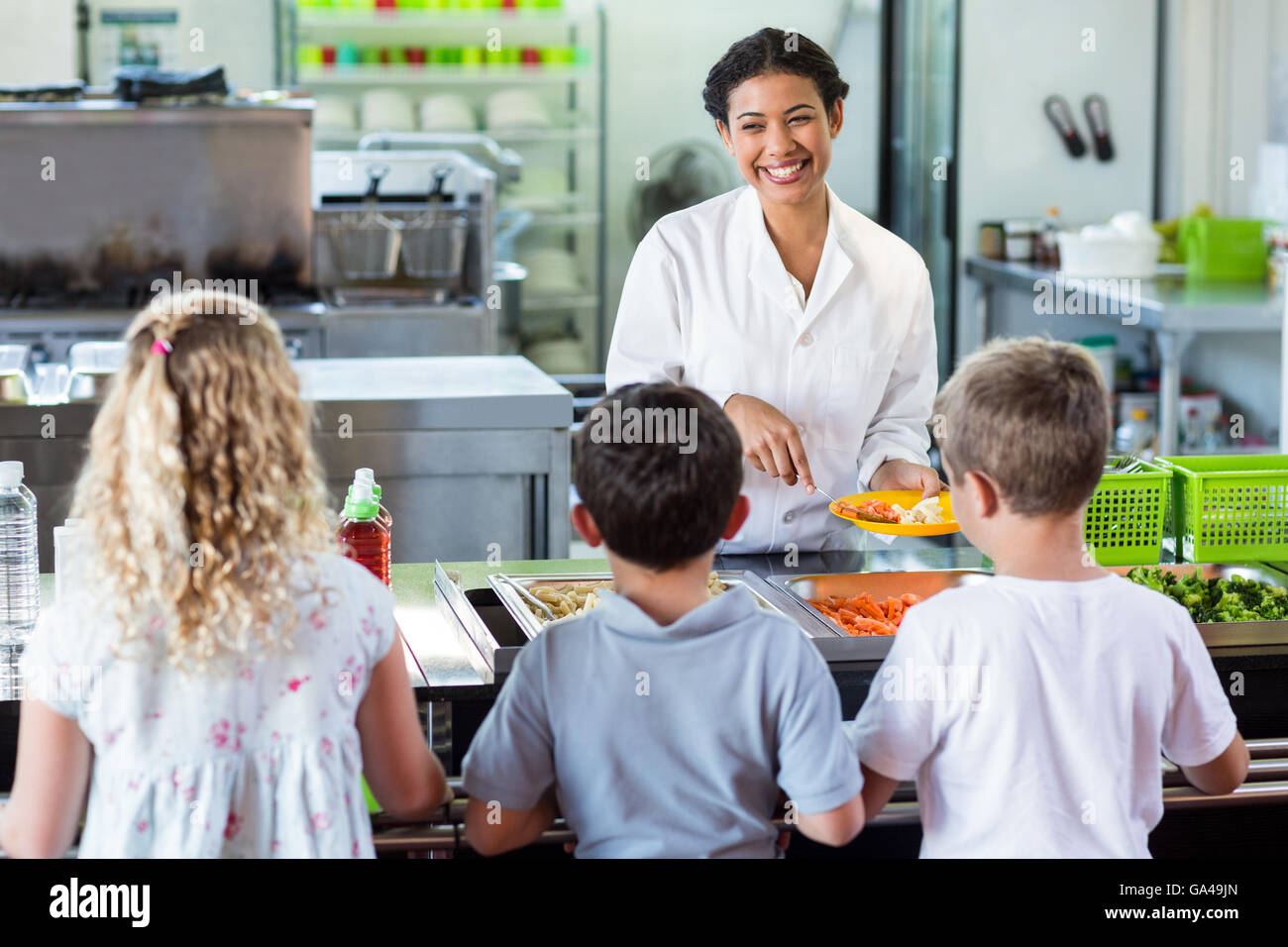 Schoolchildren serving meal hi-res stock photography and images - Alamy