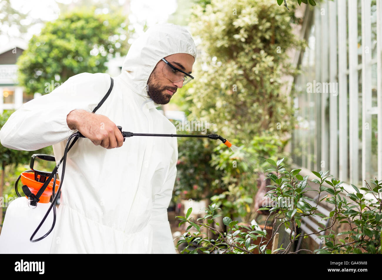 Man spraying pesticides hi-res stock photography and images - Alamy