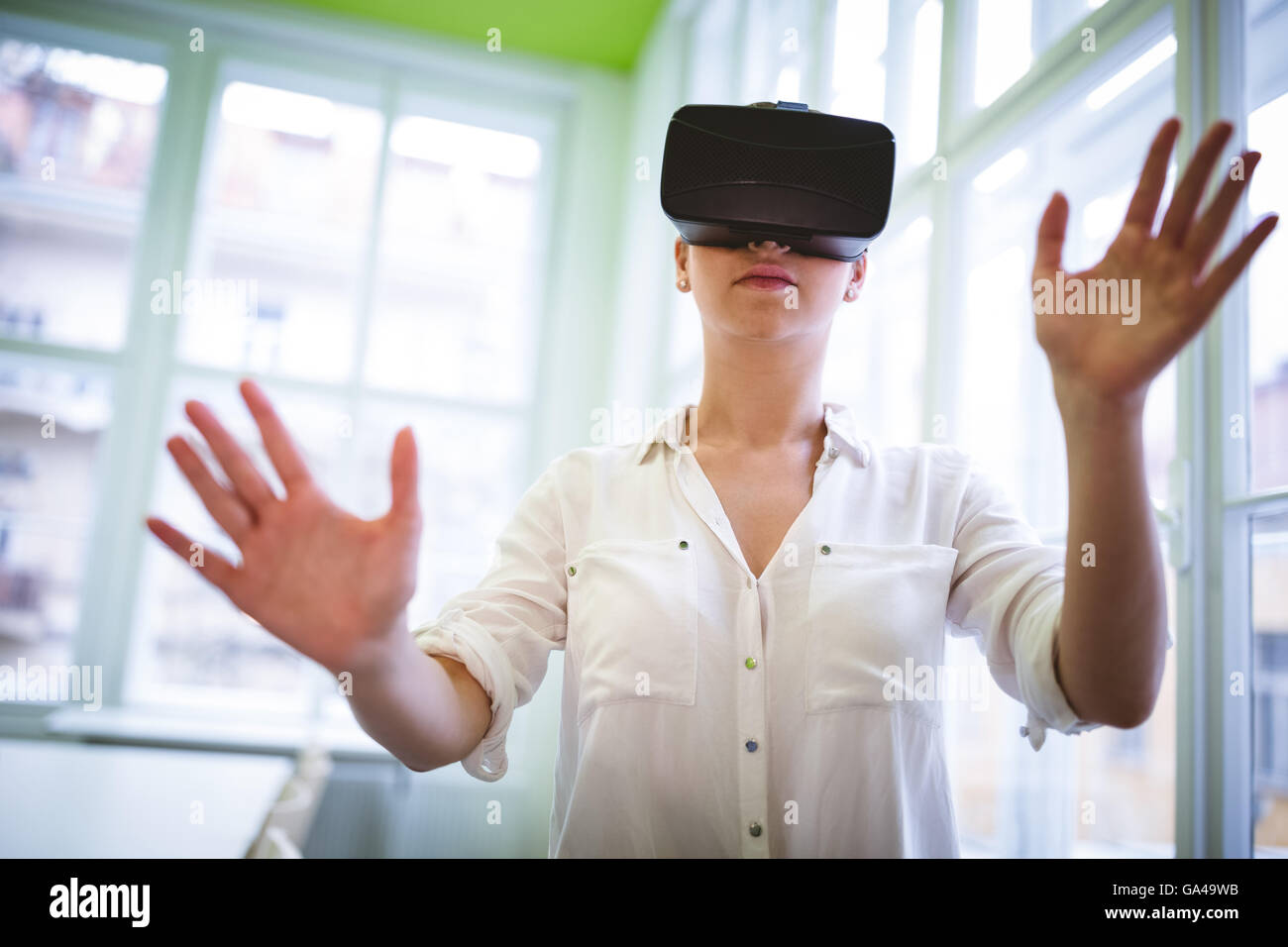 Female graphic designer using virtual reality headset Stock Photo - Alamy