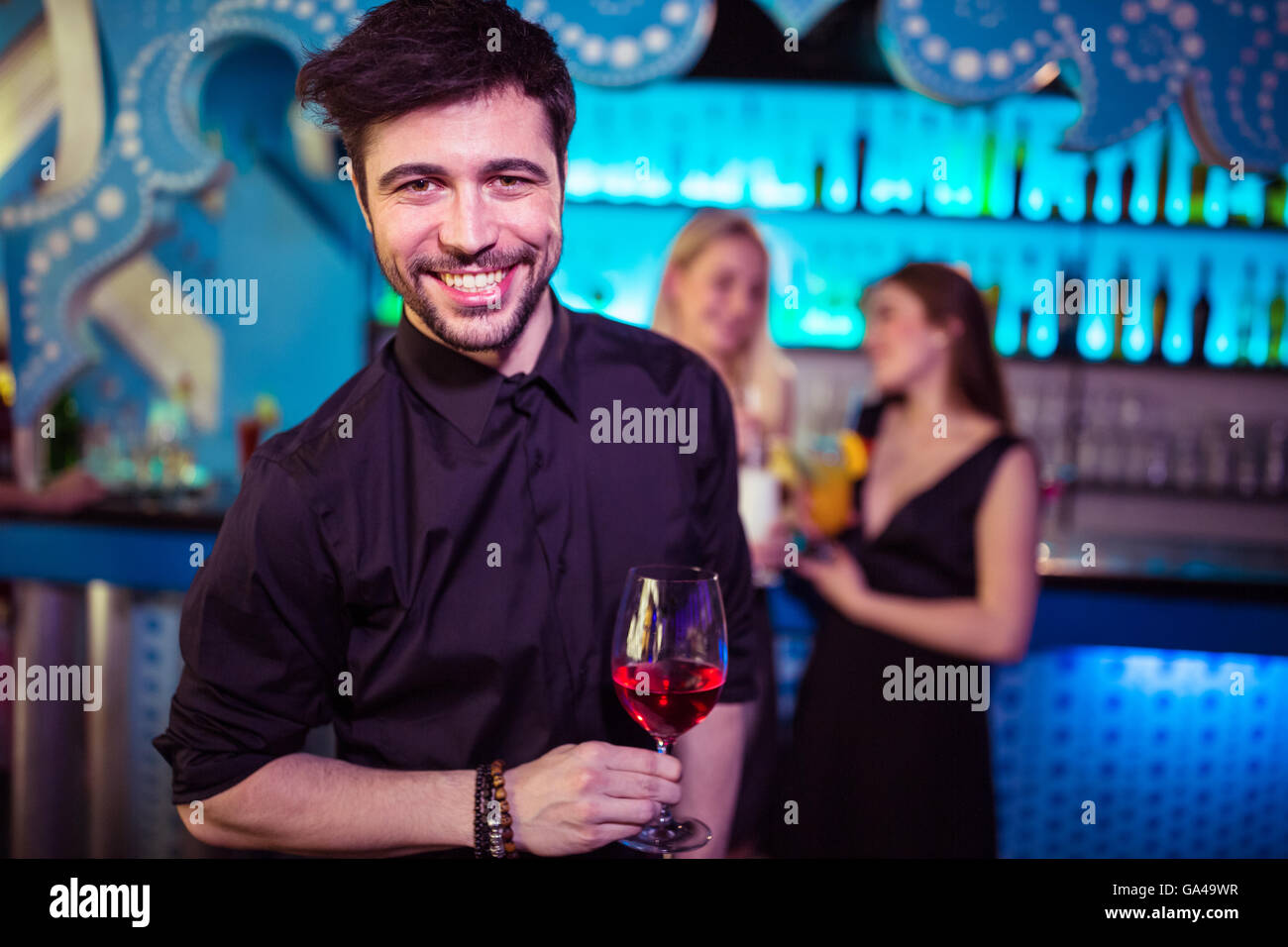 Portrait of smiling man in nightclub Stock Photo - Alamy