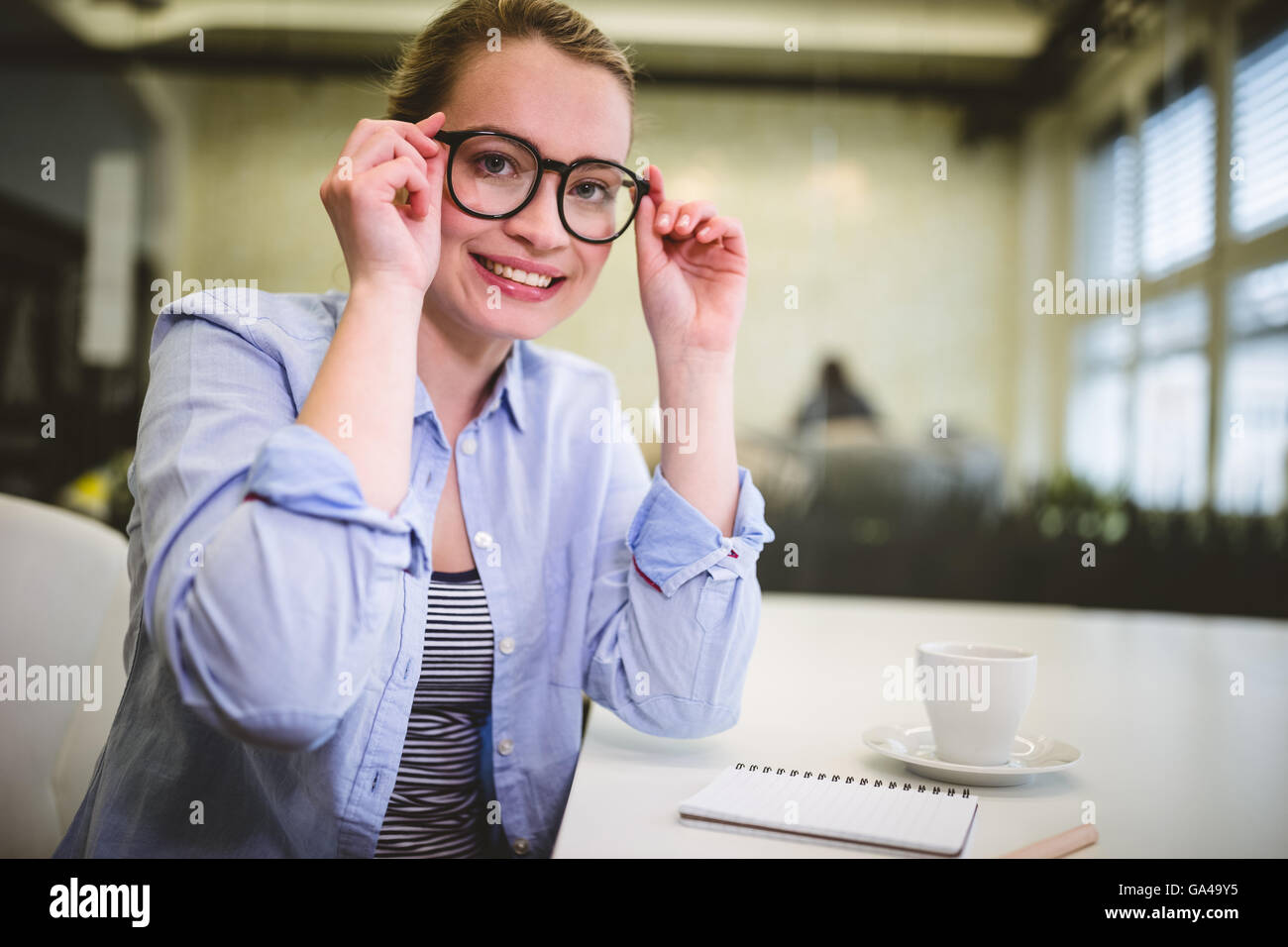 Businesswoman wearing eyeglasses Stock Photo - Alamy