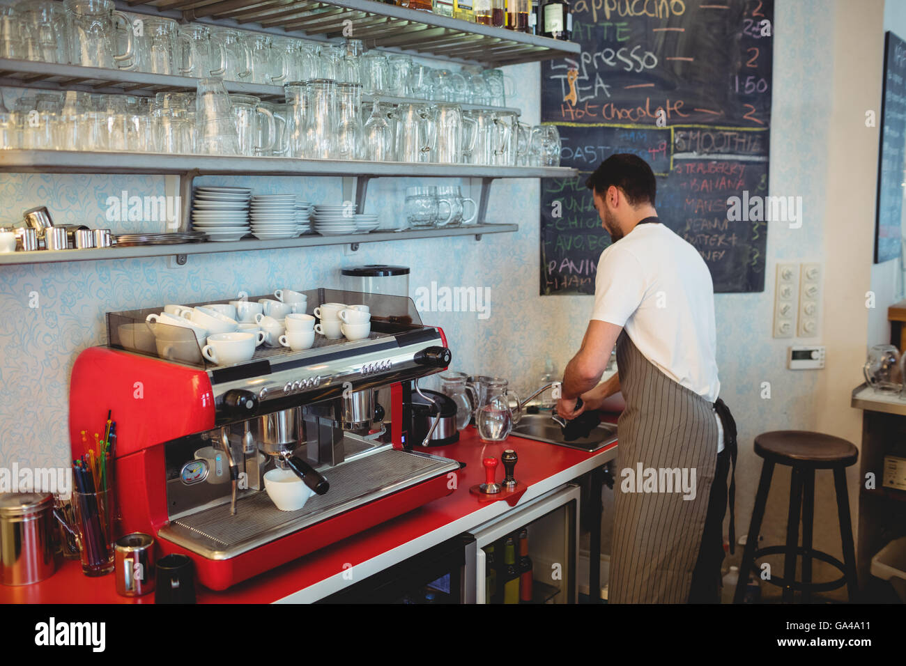 Barista working at cafe Stock Photo - Alamy