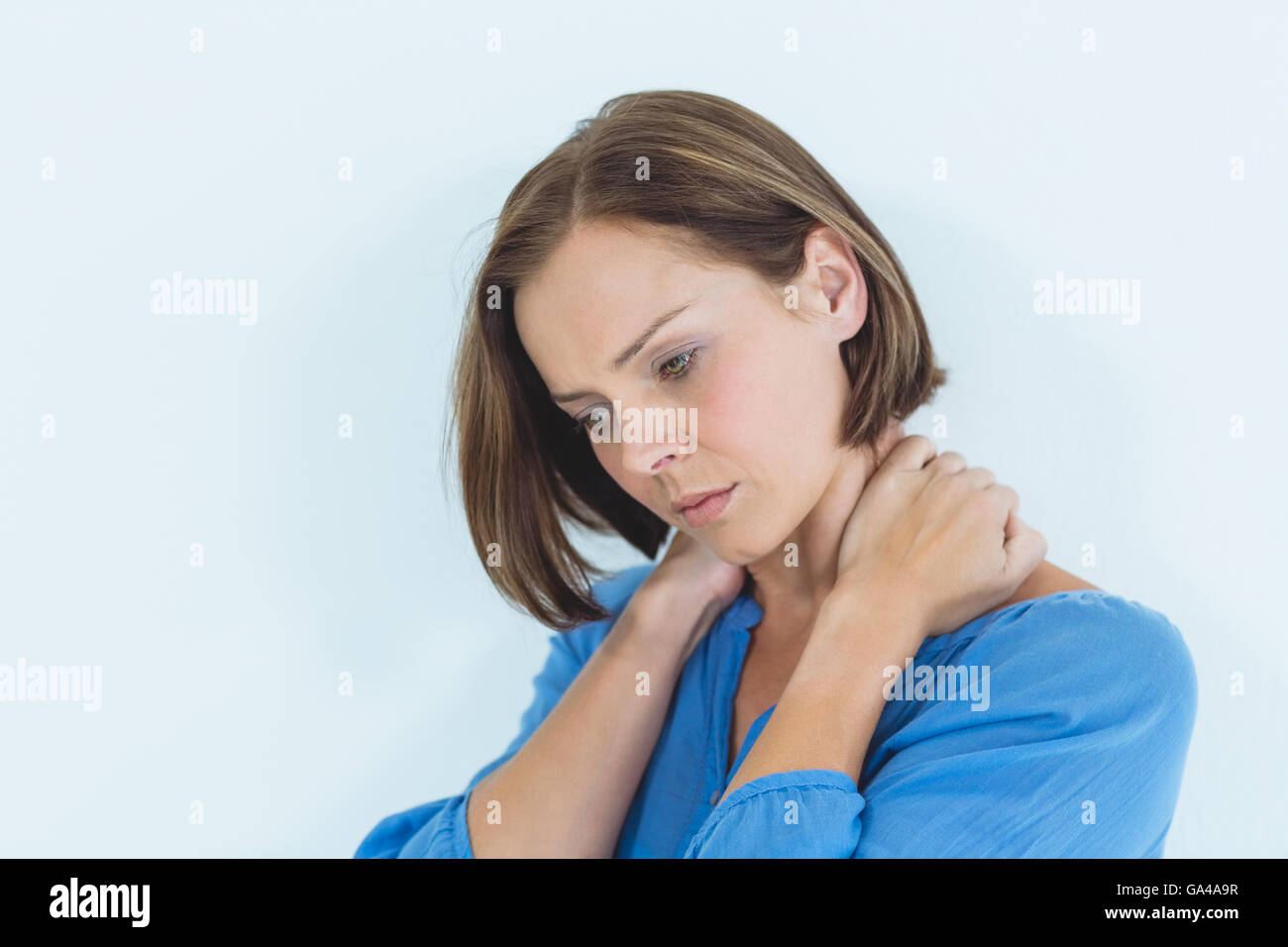 Woman suffering from neck pain Stock Photo - Alamy