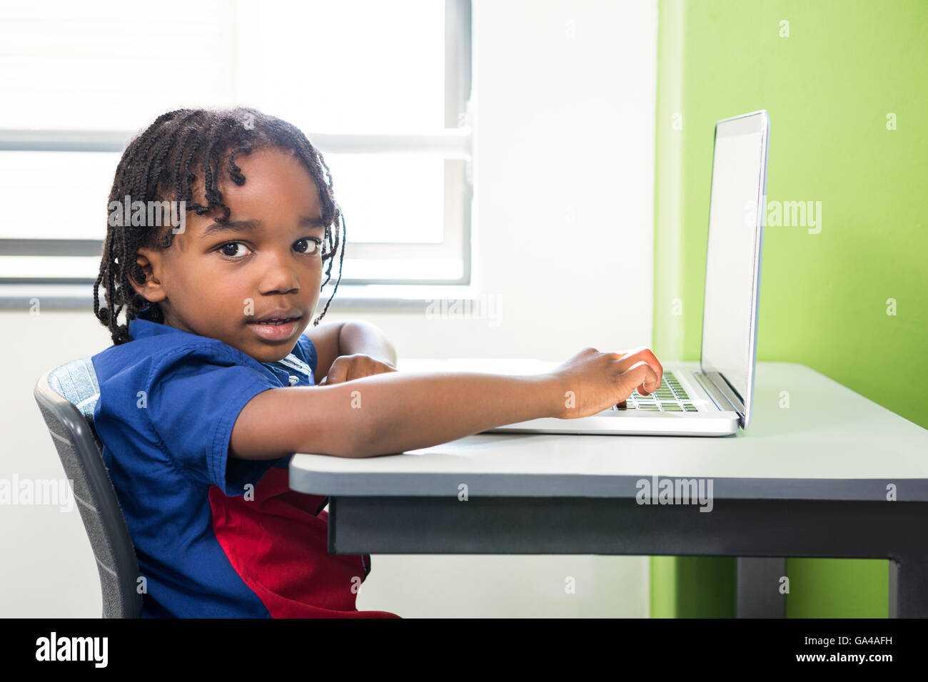 Boy laptop classroom hi-res stock photography and images - Alamy