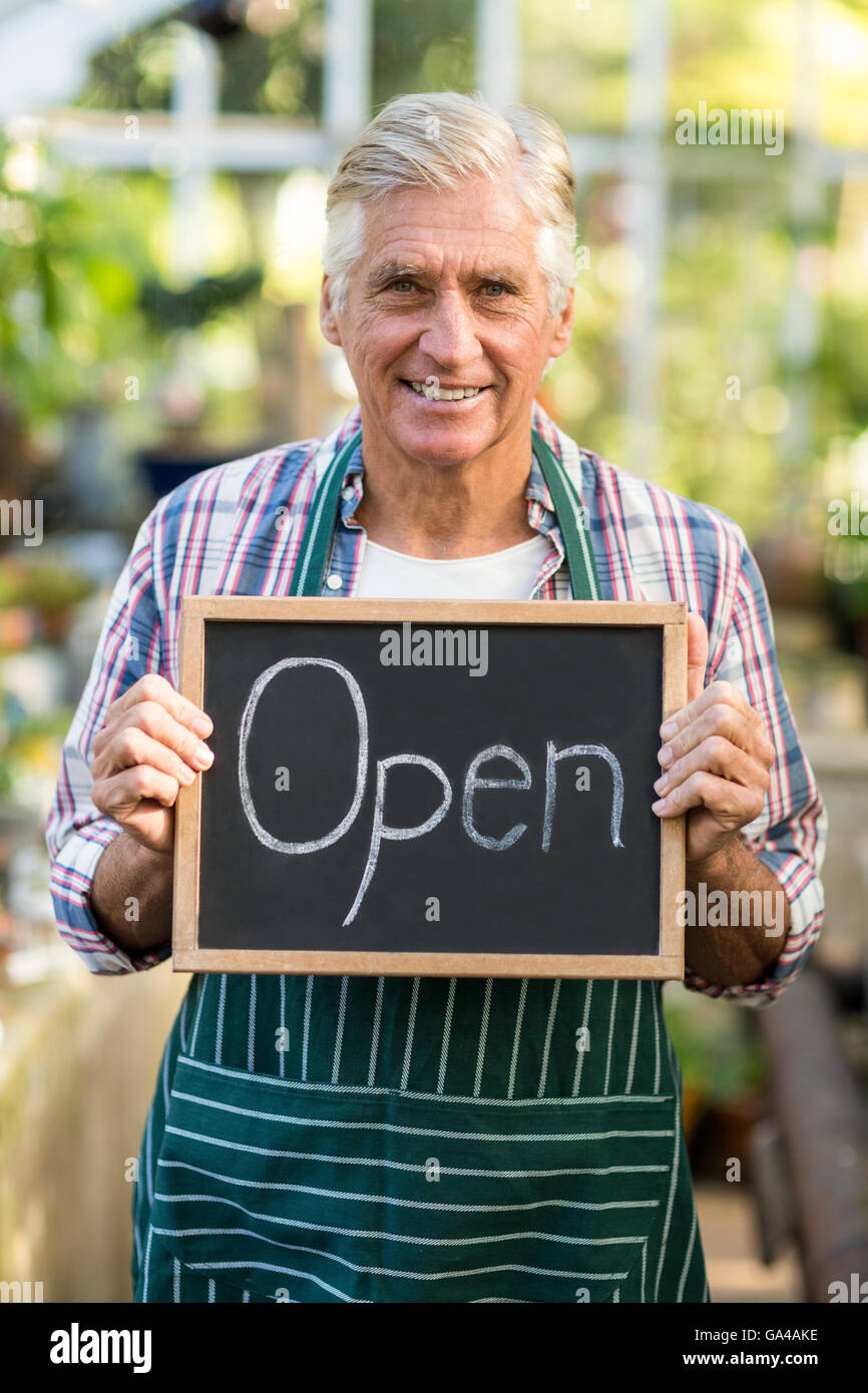 Communication standing holding placard western script hi-res stock ...
