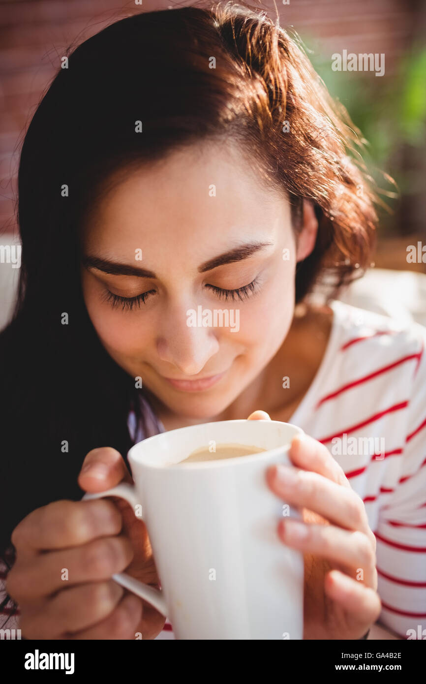 Beautiful woman holding coffee cup Stock Photo - Alamy