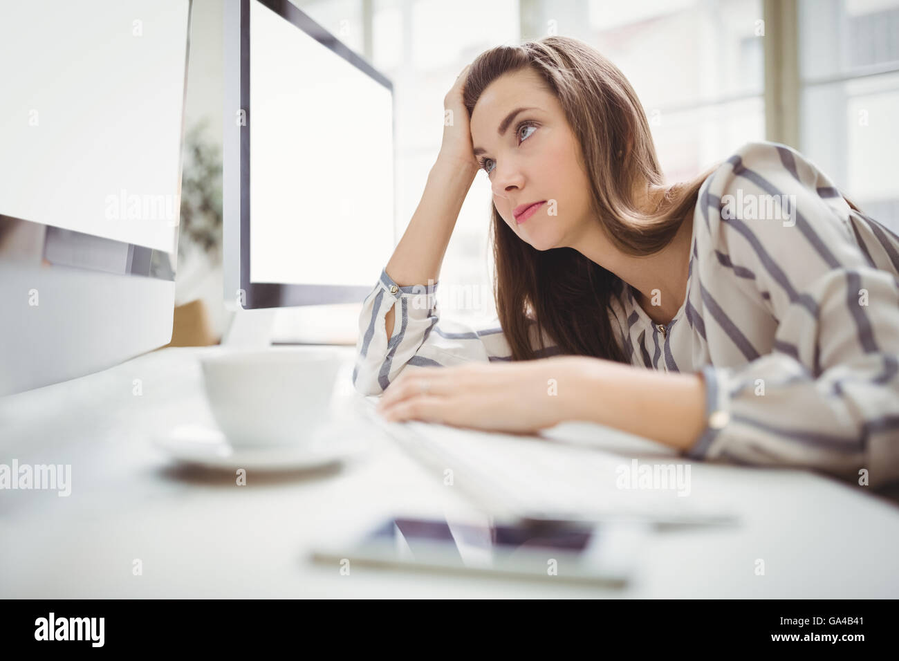 Tired woman looking computer hi-res stock photography and images - Alamy