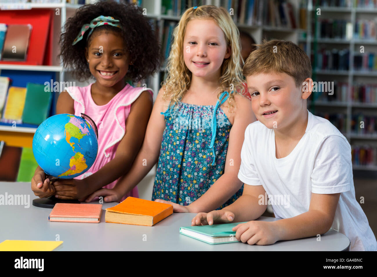 Children looking at map hi-res stock photography and images - Alamy
