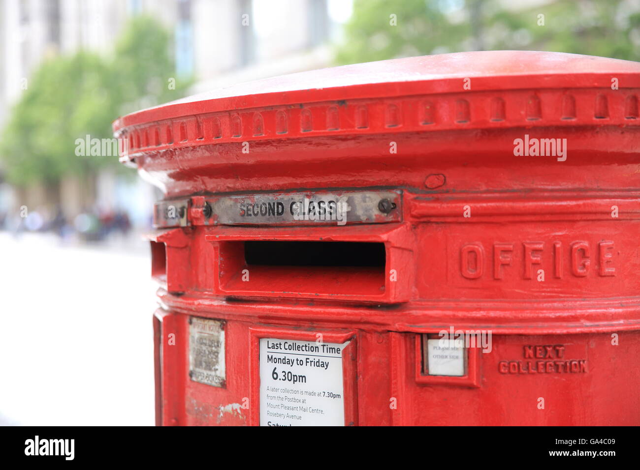 Red british post box in a city street hi-res stock photography and ...