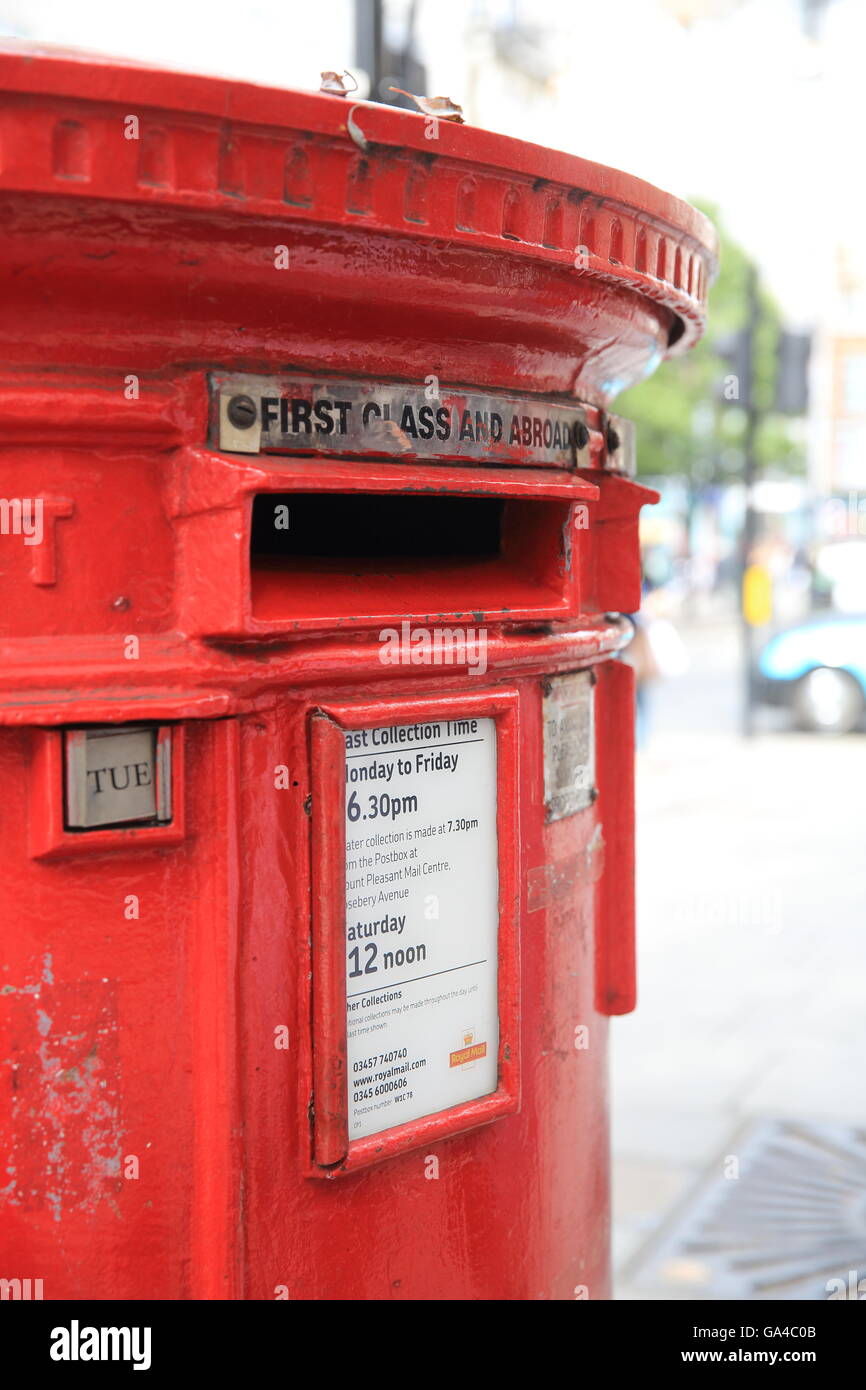 Red british post box in a city street High Resolution Stock Photography ...