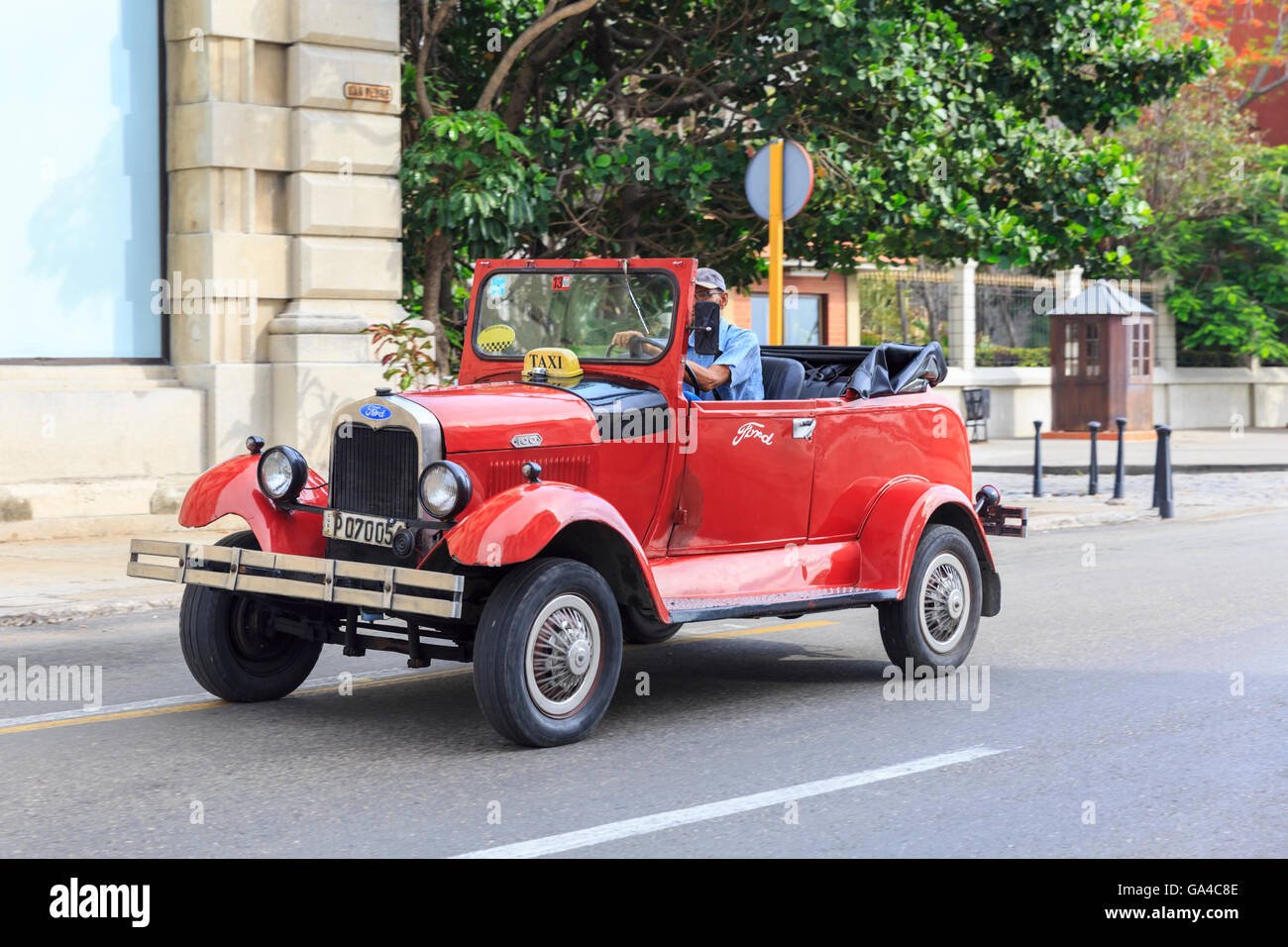 Ford convertible American classic car taxi in red color driving in ...