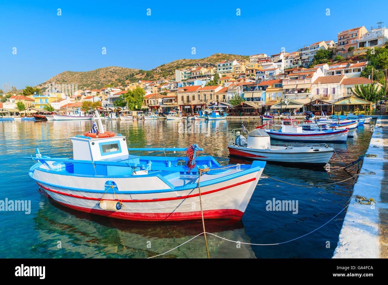 Typical colorful Greek fishing boats in Pythagorion port on Samos ...